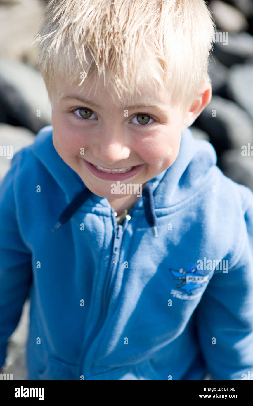 Portrait of boy grinning Stock Photo - Alamy