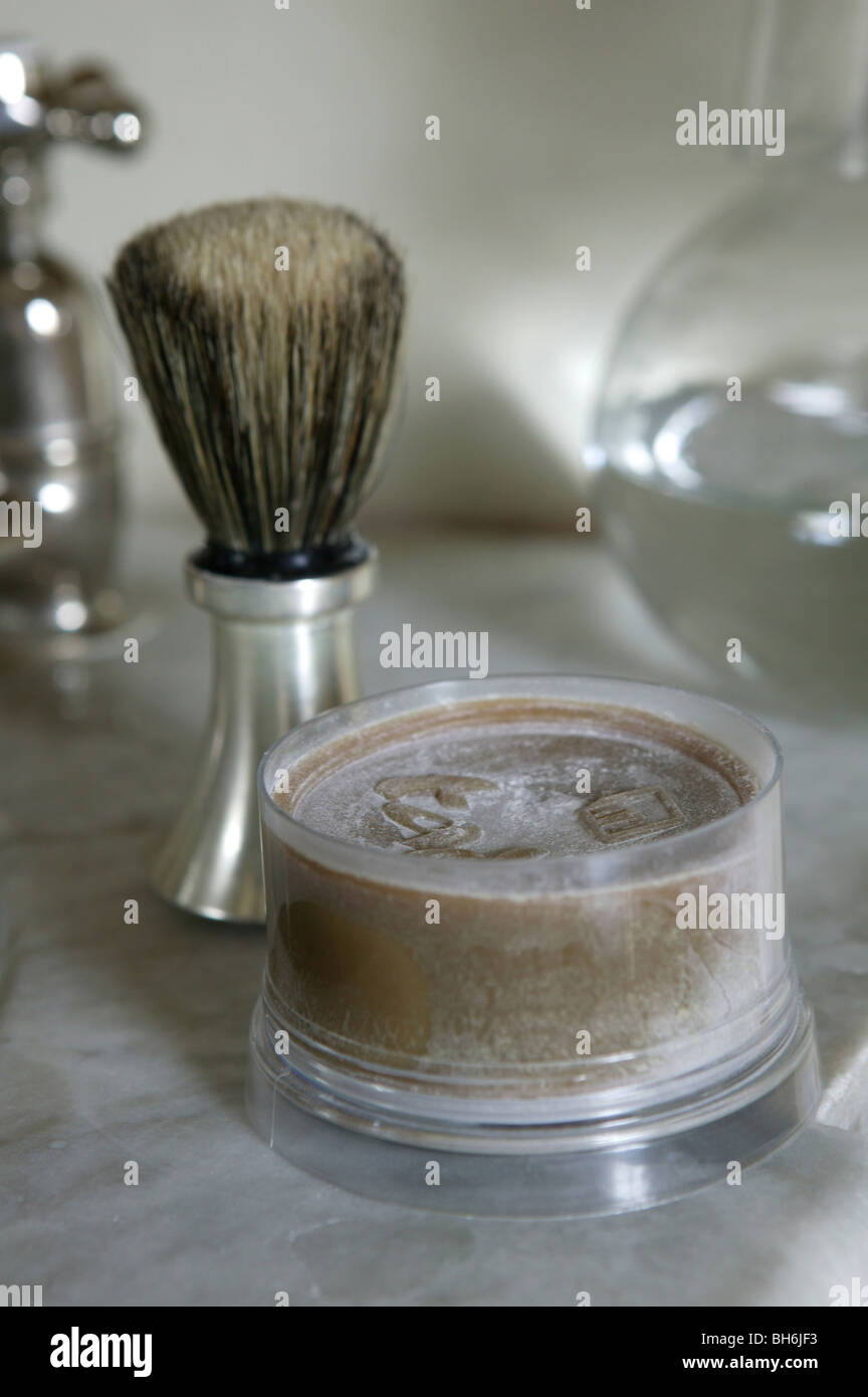 traditional male shaving equipment laid on the bathroom unit including ...