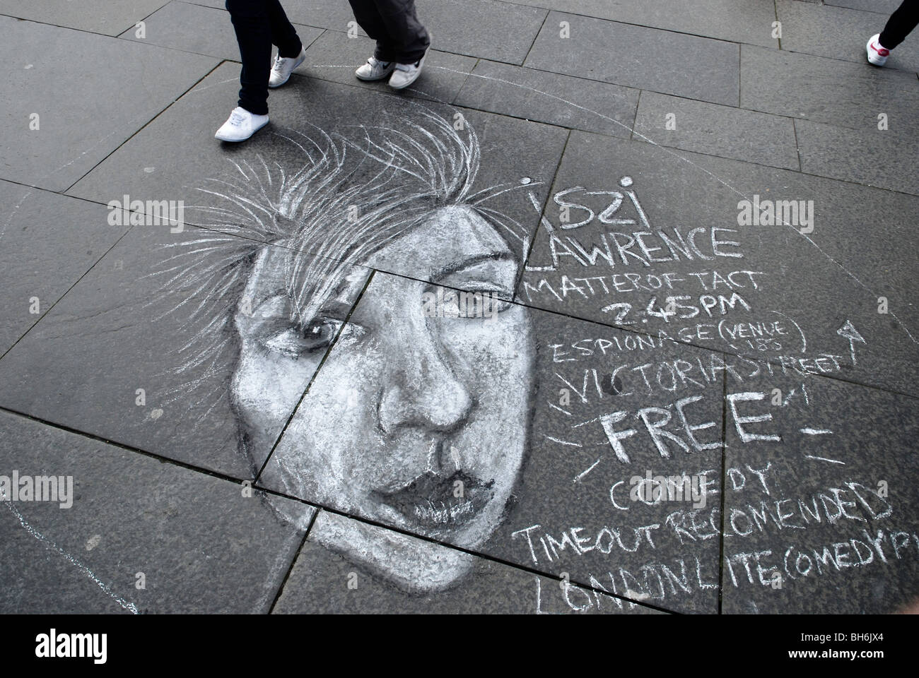 A chalk drawing on the pavement advertising a Edinburgh Festival Fringe ...