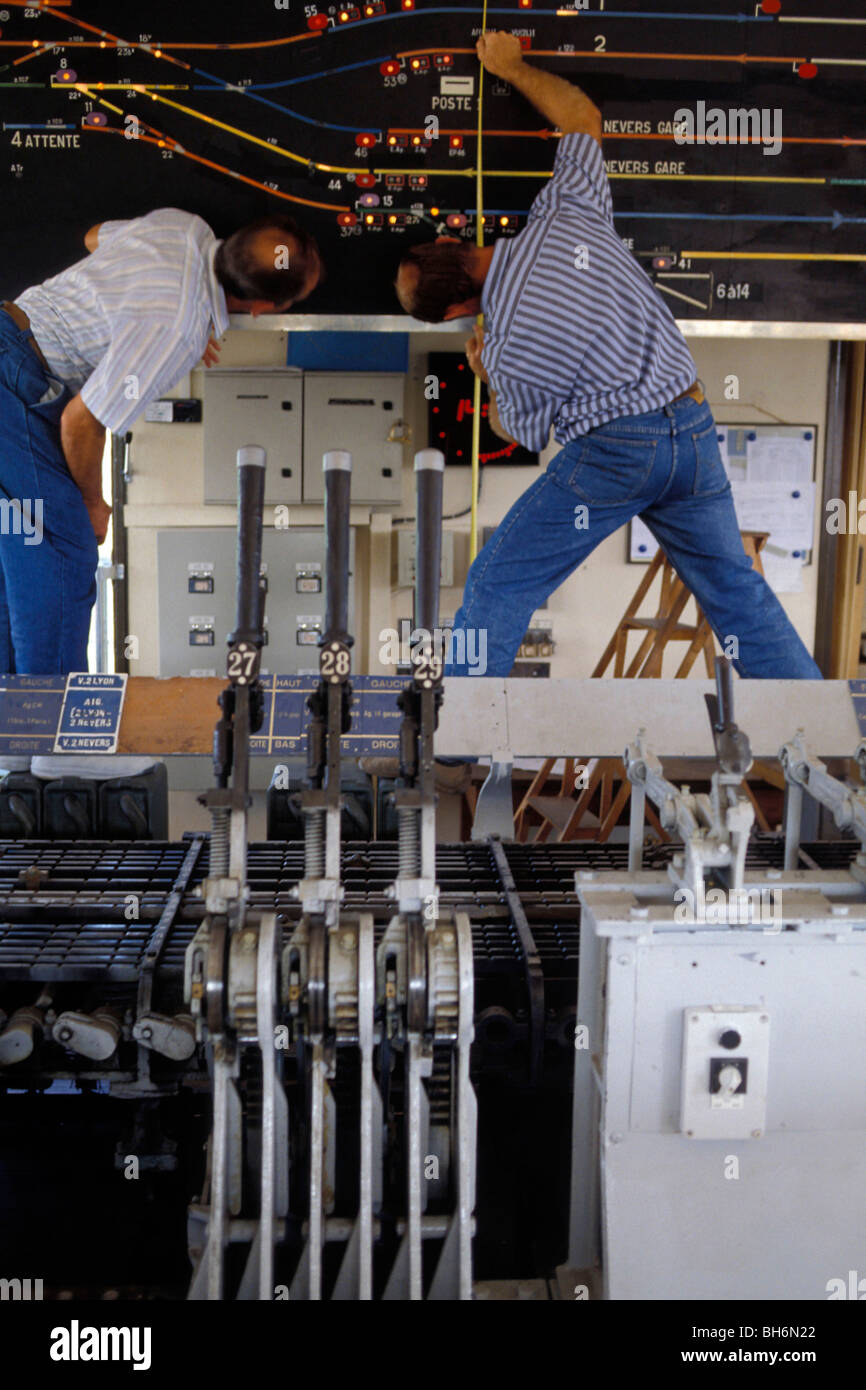 Railway worker technicians maintaining a shunting sign hi-res stock ...