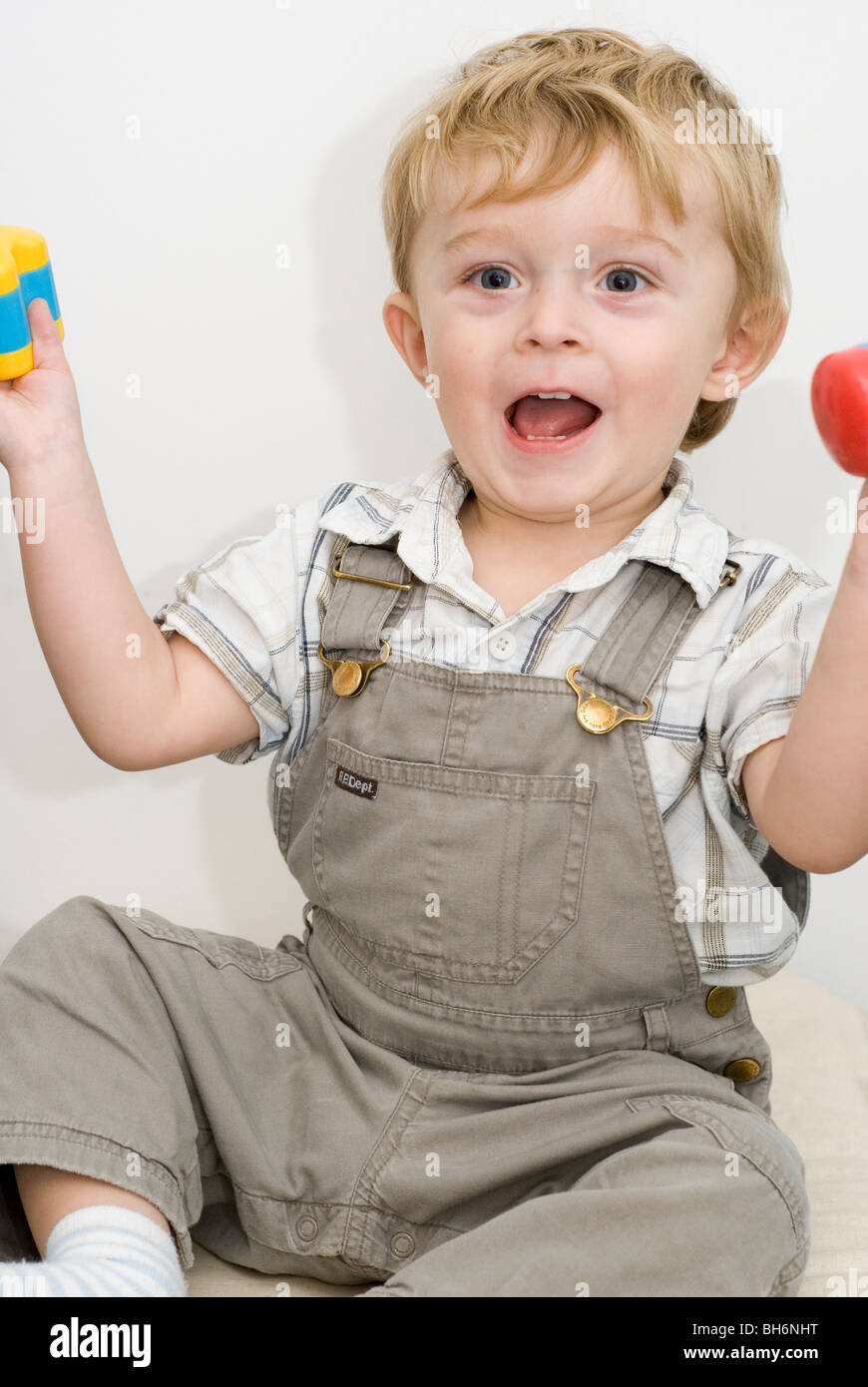 Toddler Boy Aged 19 Months Shaking Rattles from Shape Sorter Toy ...