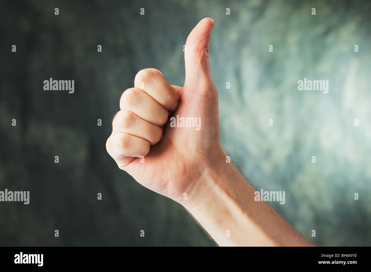 Man doing a Thumb up hand gesture Stock Photo - Alamy