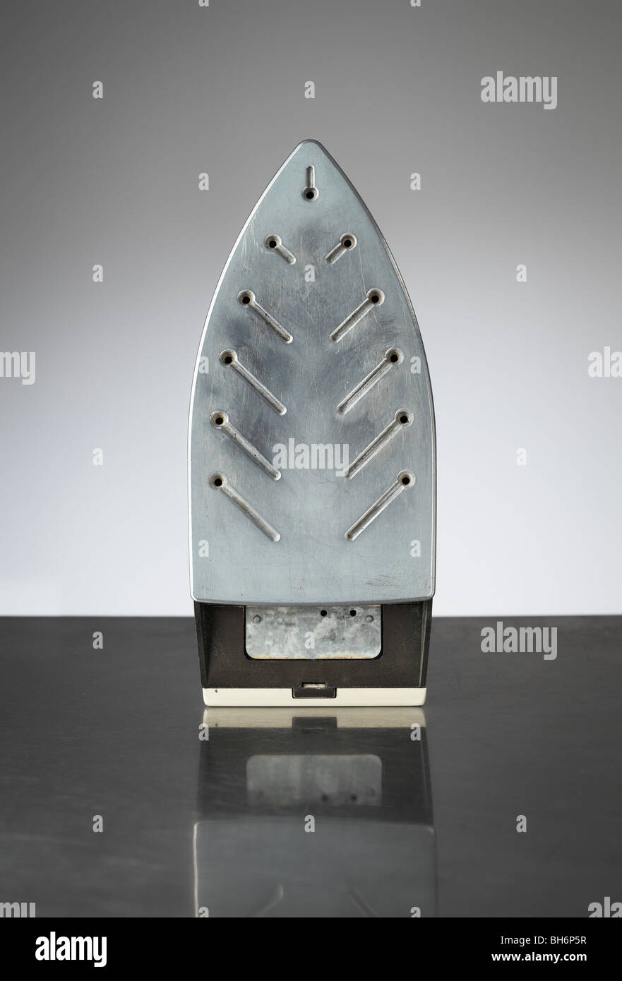Old worn and scratched iron on reflective metal Stock Photo - Alamy