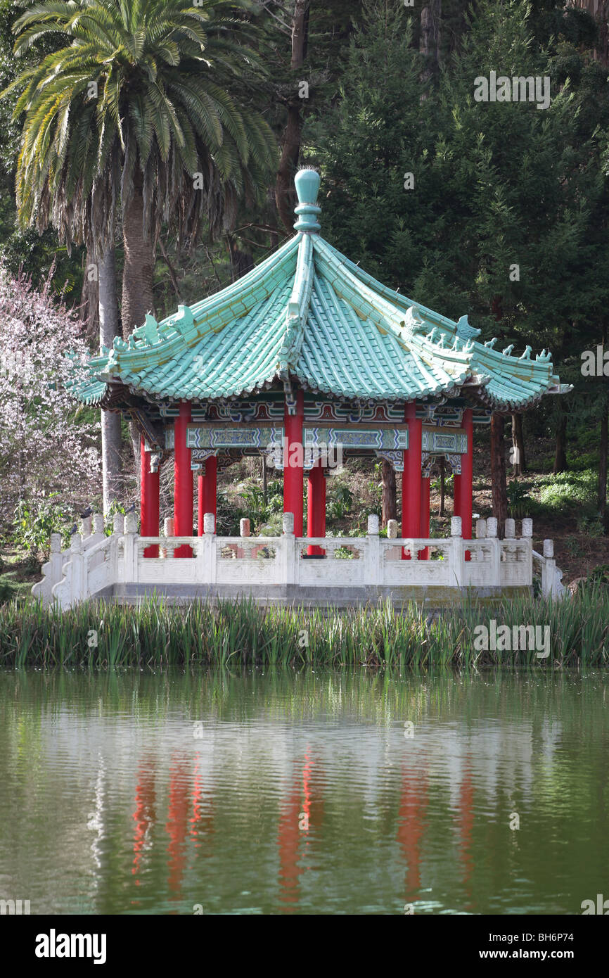 A small scale pagoda on an island in a japanese garden Stock Photo - Alamy