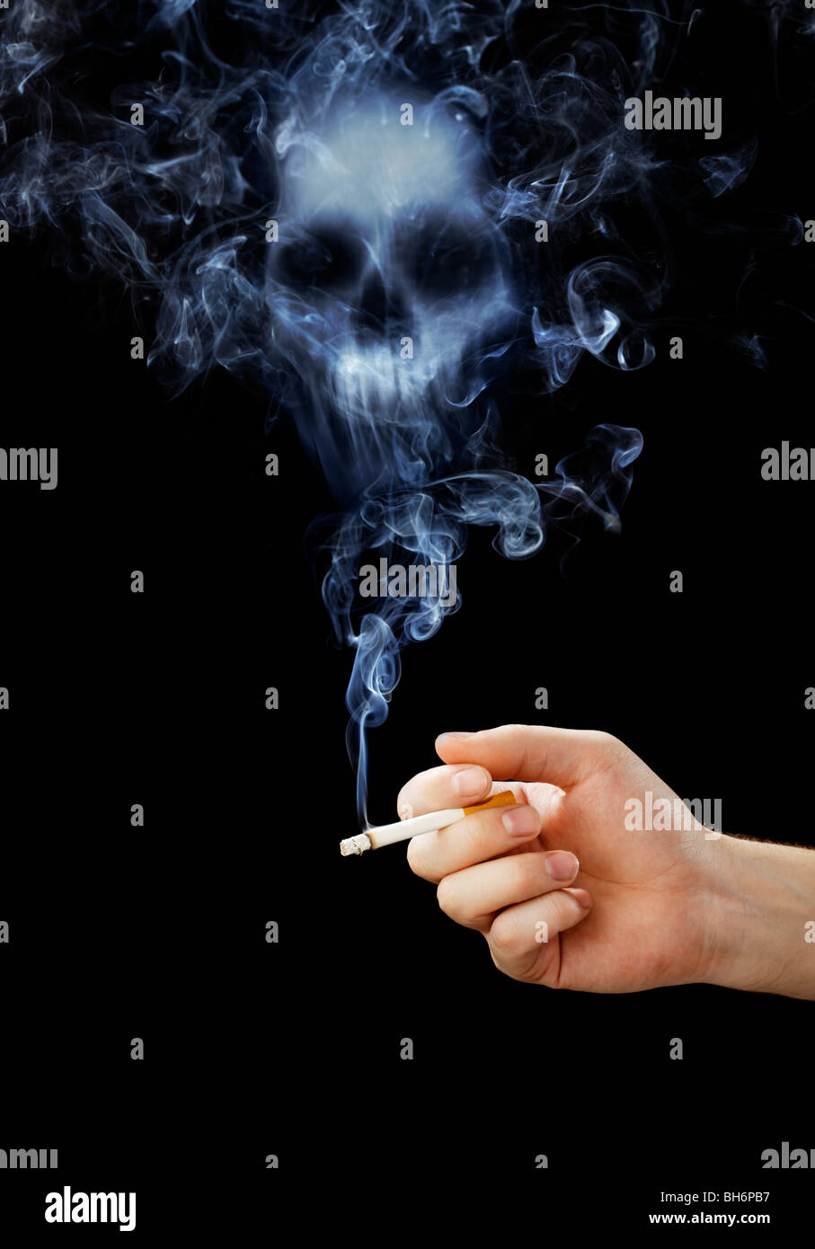 Hand holding a cigarette with deadly smoke Stock Photo - Alamy