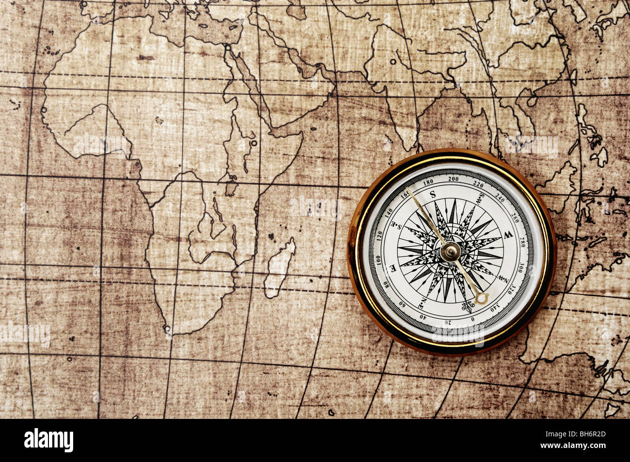 Compass on old map. Brown tone color Stock Photo - Alamy