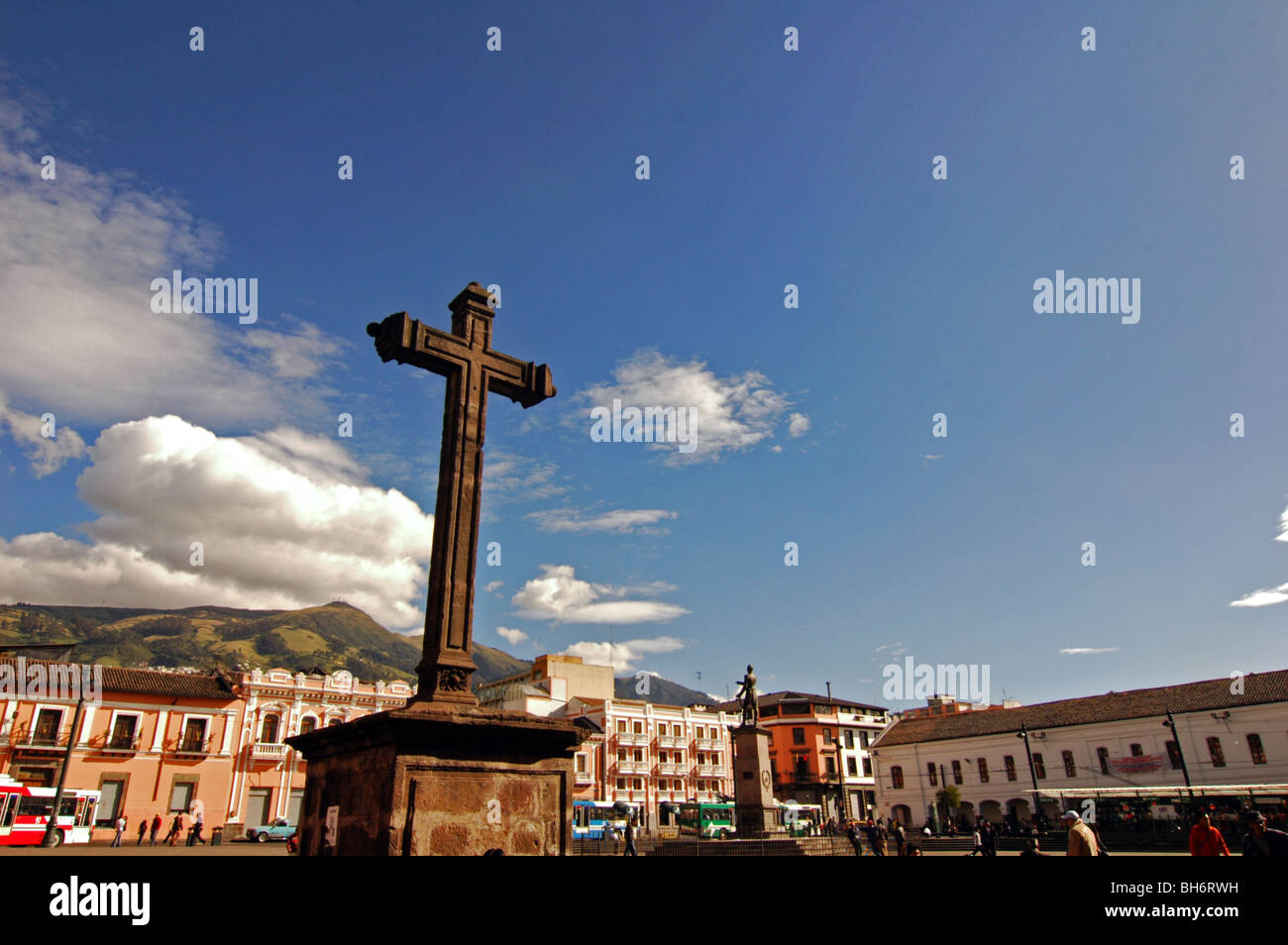 Ecuador, Quito, People sitting on the ground at Quito city square with ...