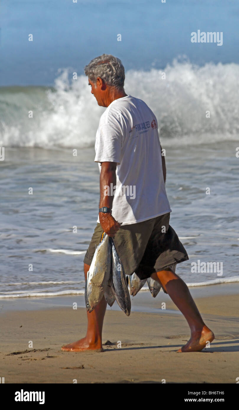 Puerto Escondido Oaxaca Mexico, man with fish on beach Stock Photo - Alamy