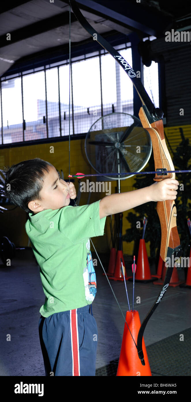 Little boy practicing archery Stock Photo - Alamy