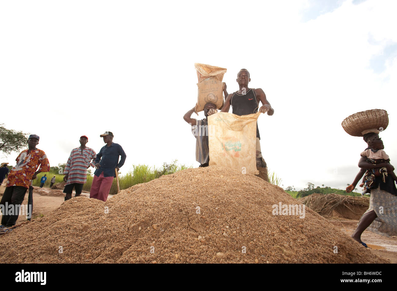 Men delivering gravel for diamond mining Kono district Sierra Leone ...