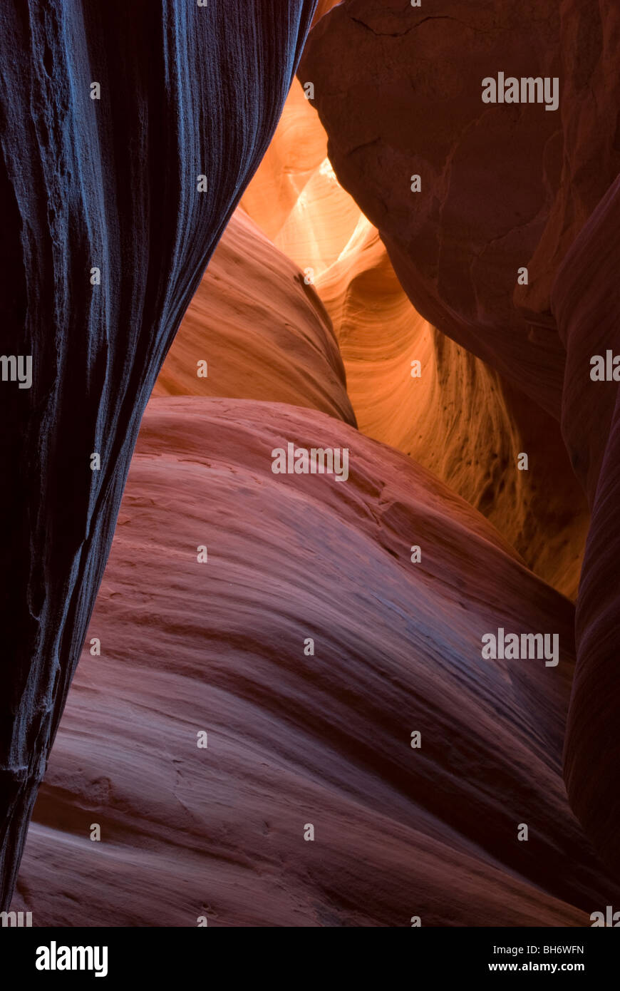 USA, Arizona, Navajo Tribal Lands. Reflected sunlight creates amber ...