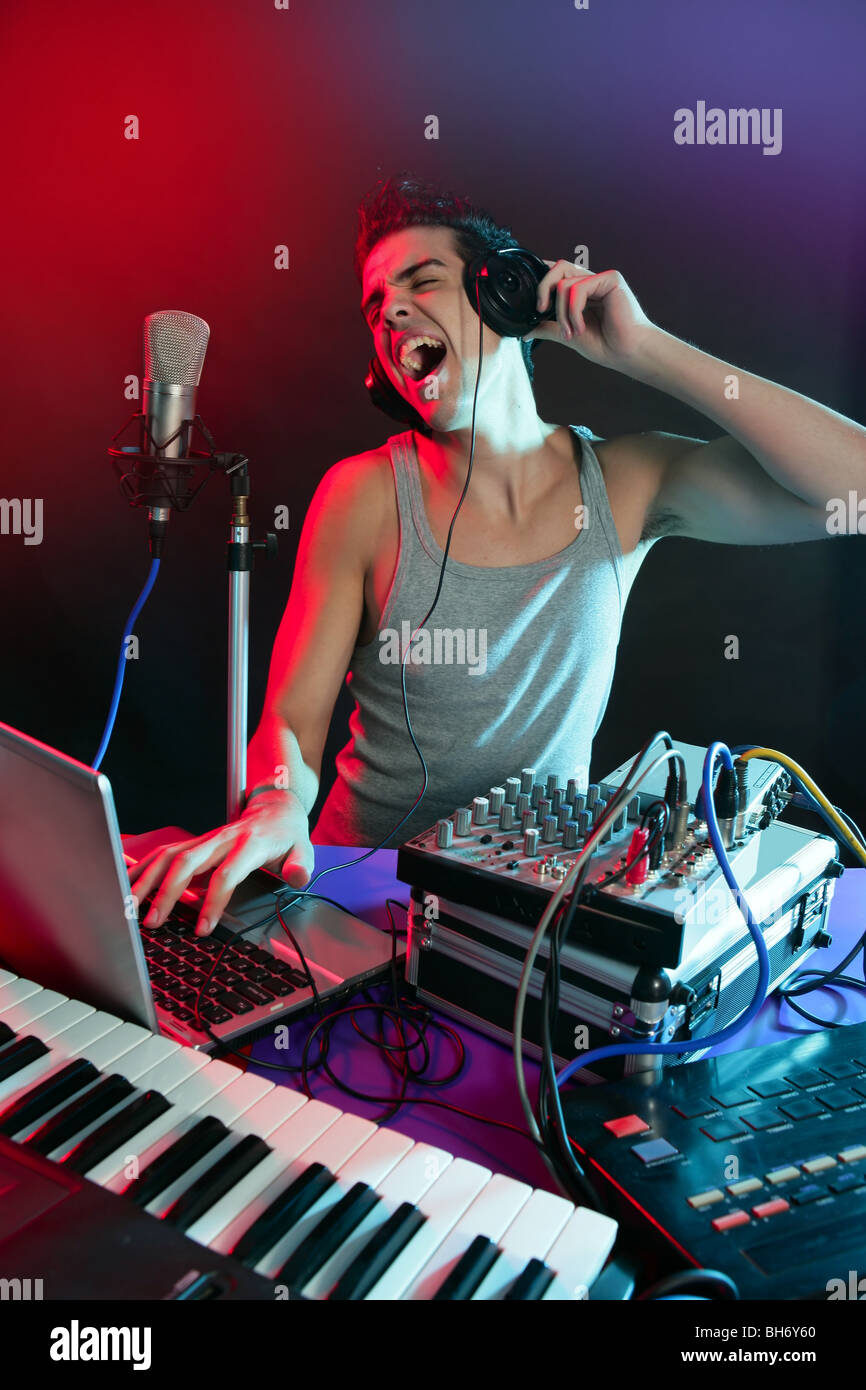 Dj with colorful light and music mixing digital equipment Stock Photo ...