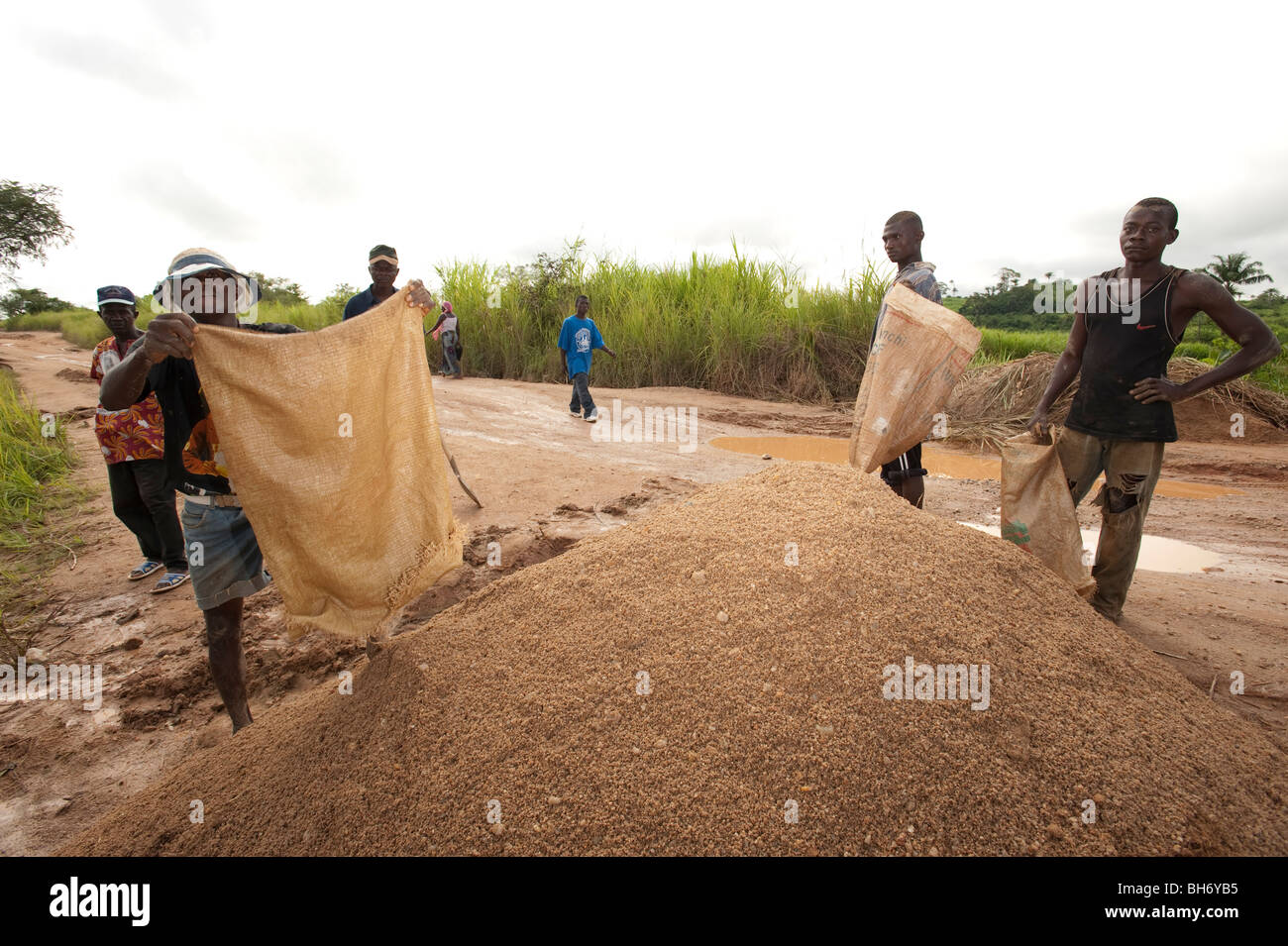 Men delivering gravel for diamond mining Kono district Sierra Leone ...