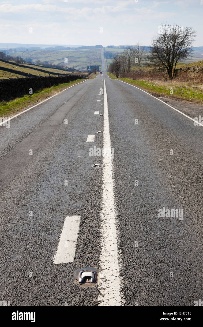 Long straight quiet country road in Northumberland National Park ...