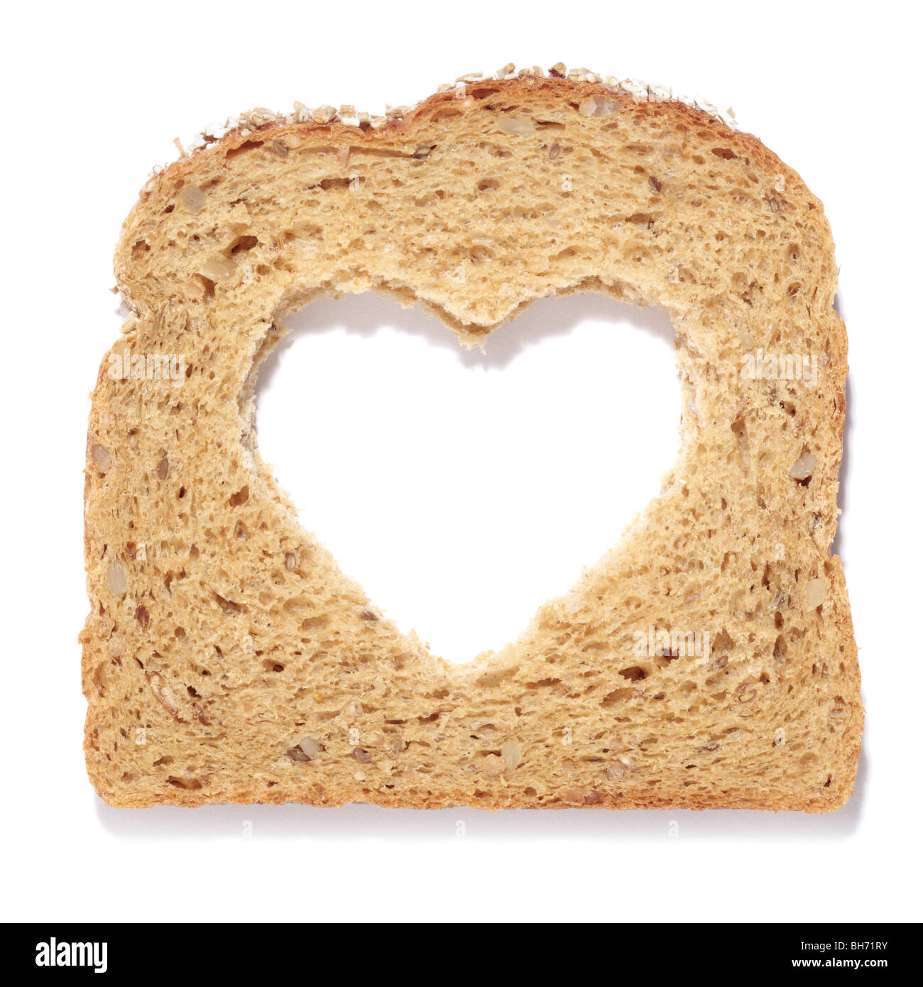 Heart shaped hole in a slice of bread Stock Photo - Alamy