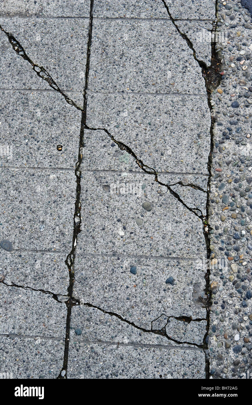 Cracks in concrete pavement Stock Photo - Alamy