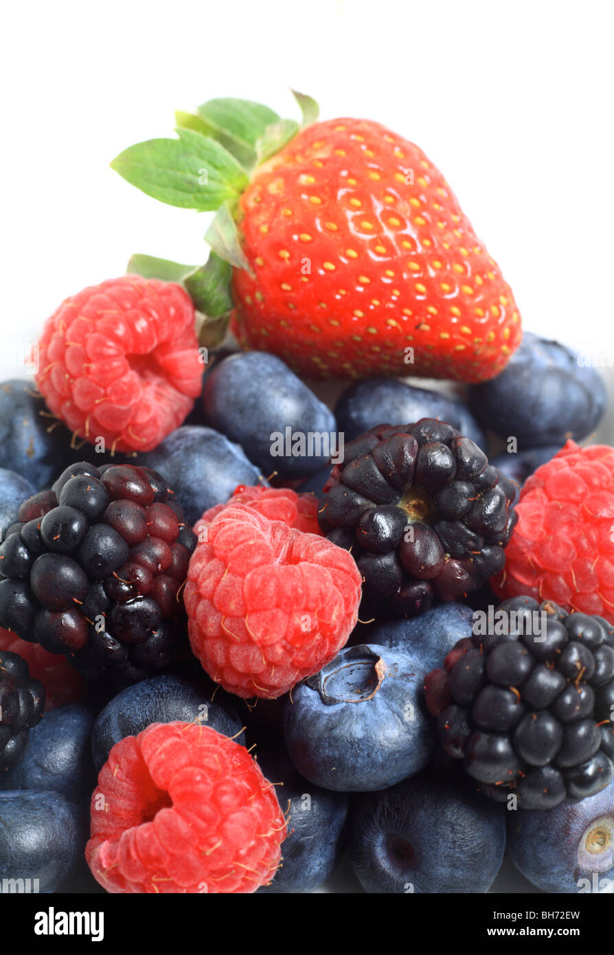 A pile of berry fruits, blueberries, raspberries, blackberries and a ...