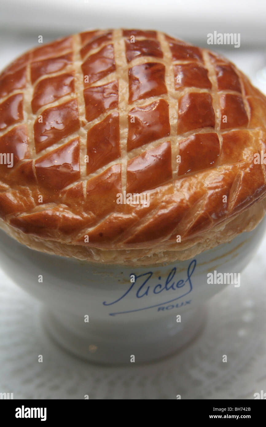 Mussel soup flavoured with saffron, served under puff pastry. A dish at ...