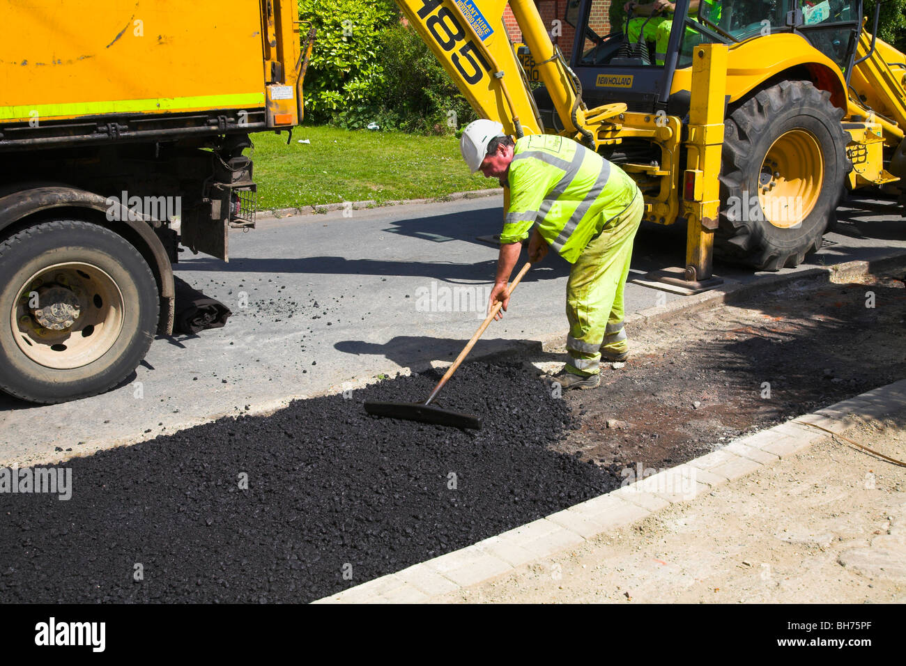 Repair of potholes using asphalt Stock Photo - Alamy