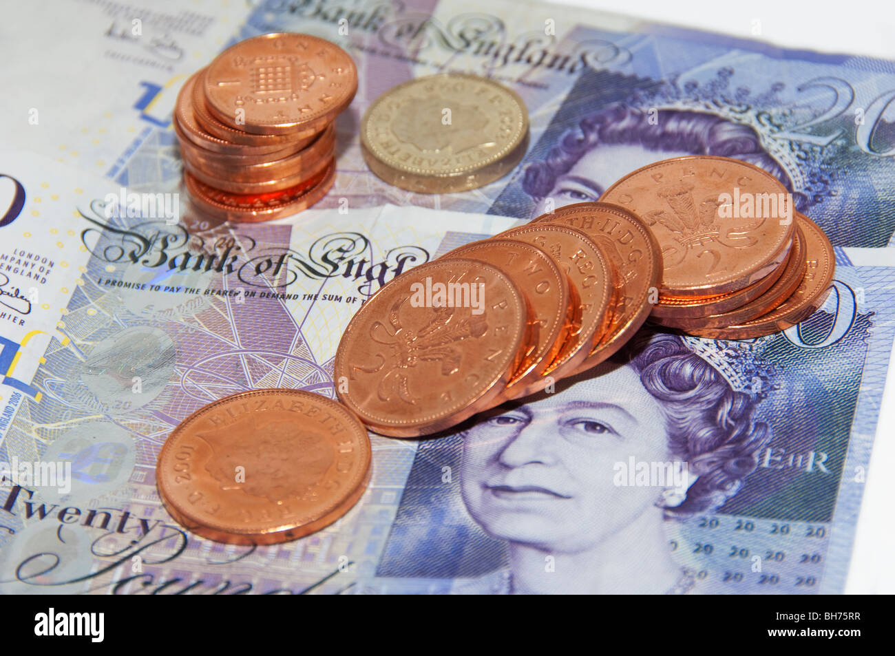 Financial concept notes coins sterling Stock Photo - Alamy