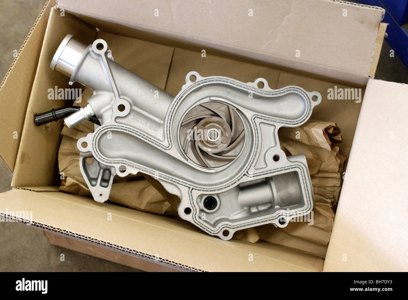 New auto part, coolant water pump Stock Photo - Alamy