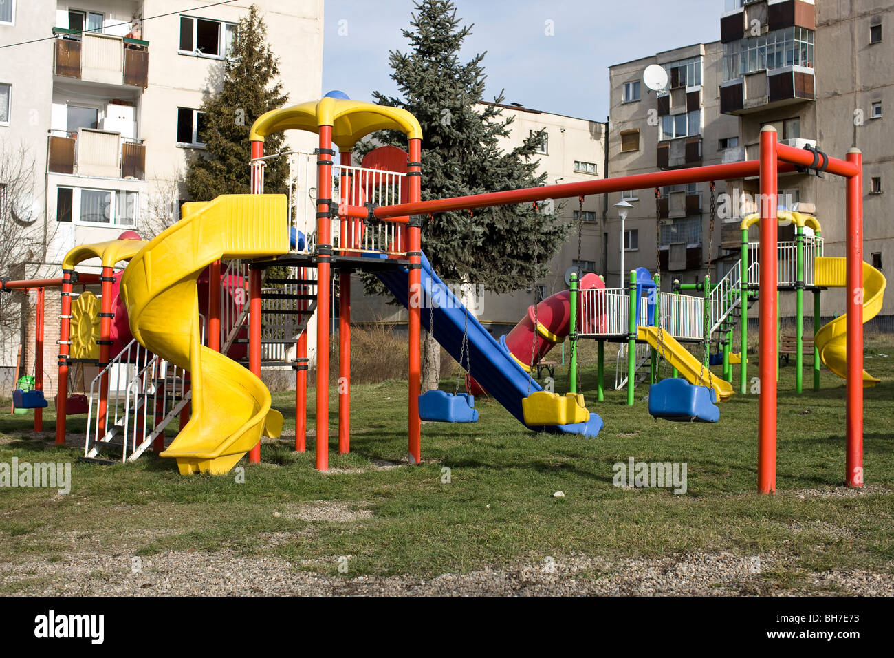 Empty children playground in front of apartment buildings in the ...
