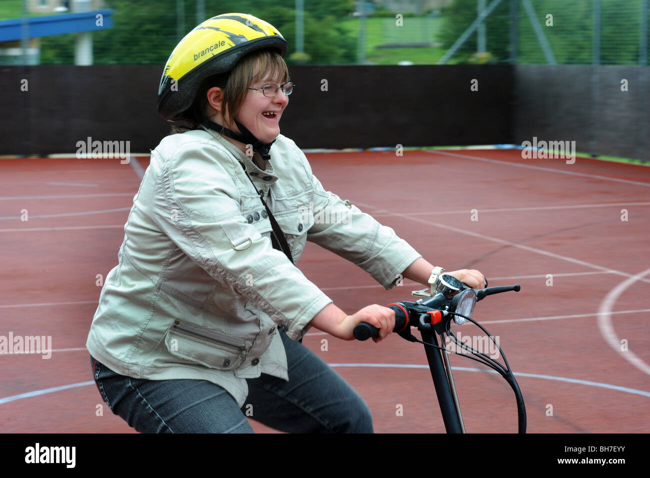A women with learning disabilities has a go at riding a tricycle, as ...
