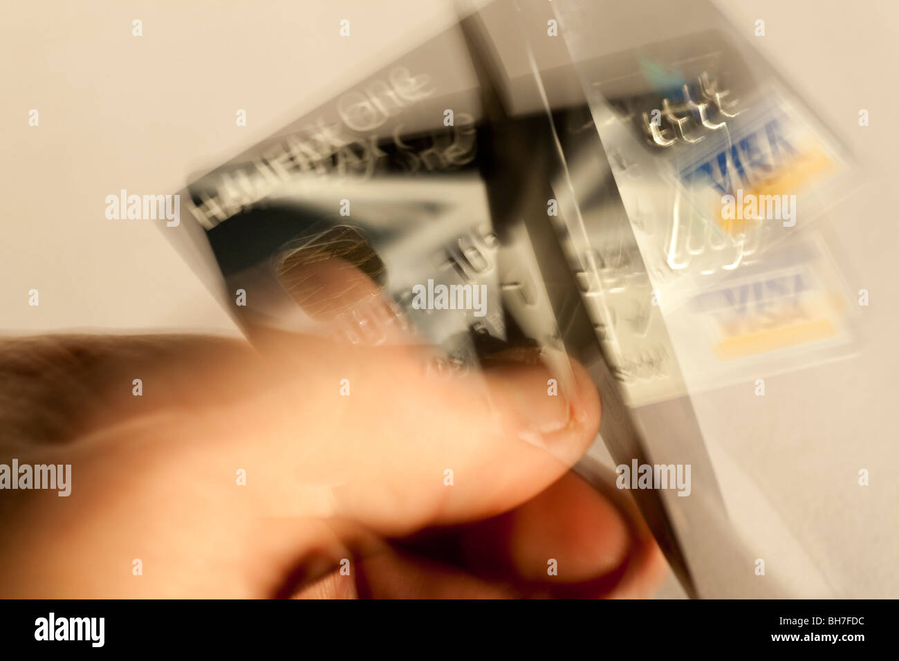 credit cards being cut Stock Photo - Alamy