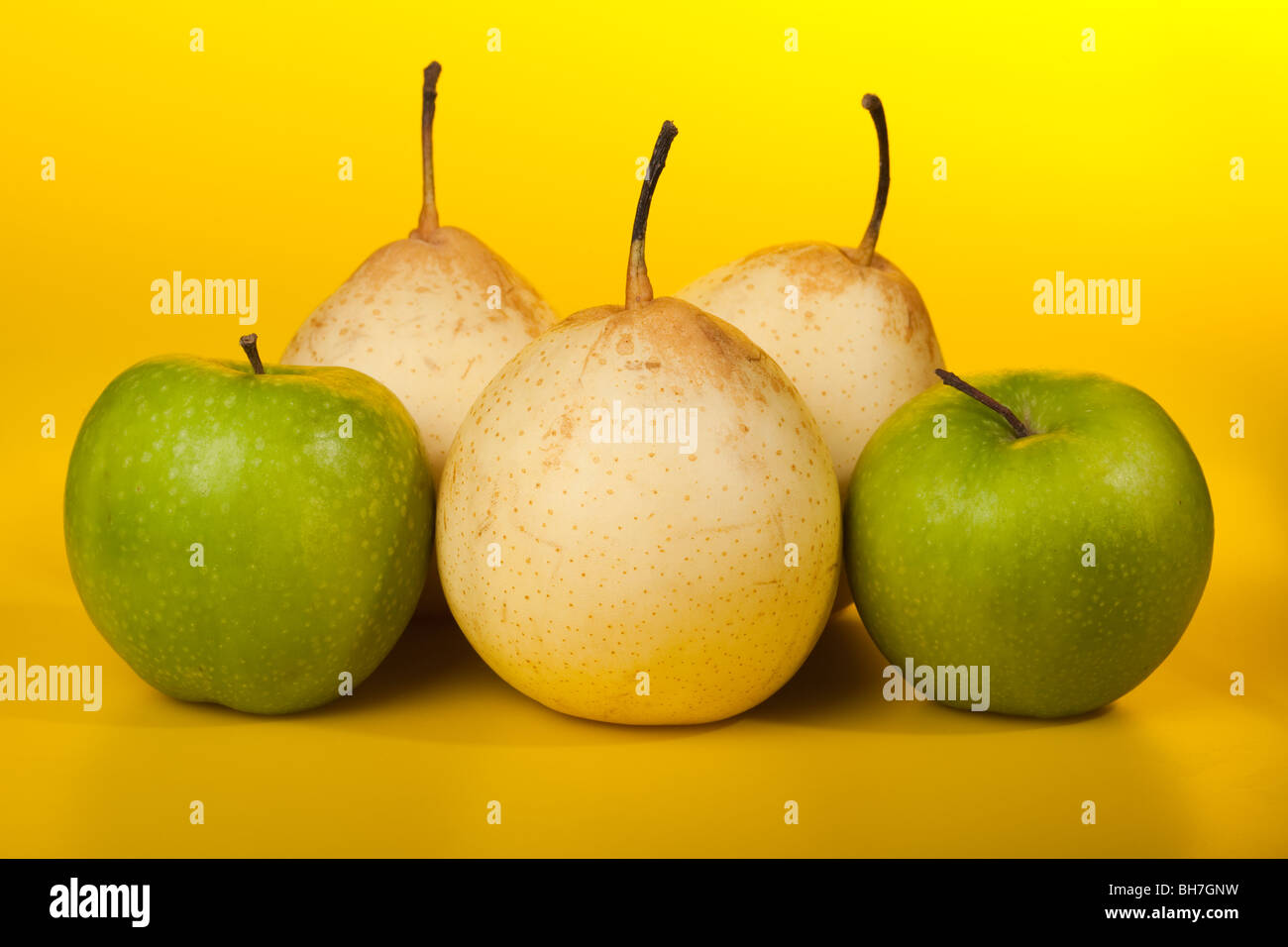 Fruit photographed on a yellow background with a gradient Stock Photo ...