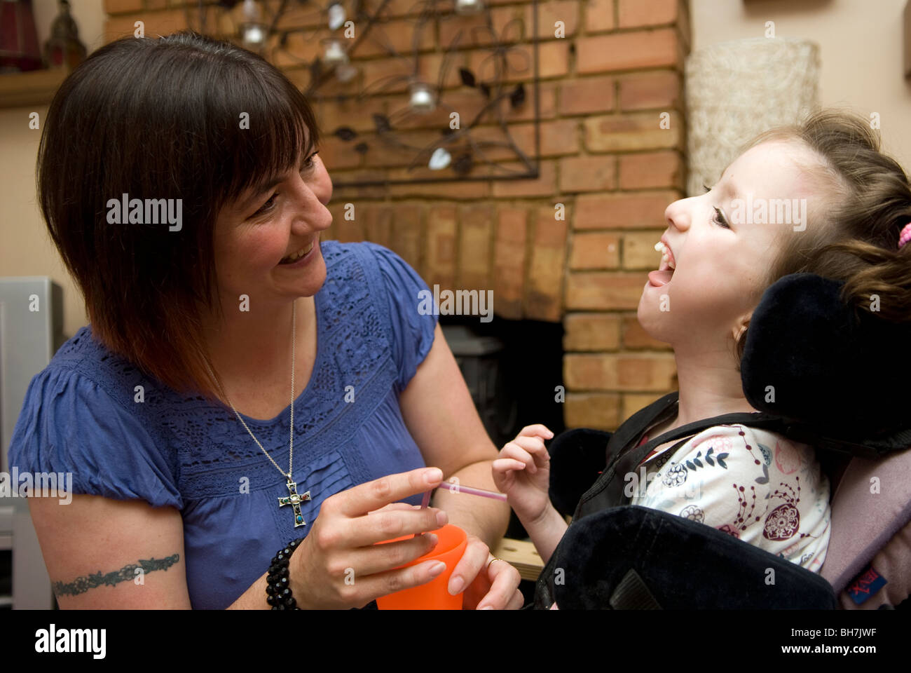 Mother with her disabled daughter (cerebral palsy), Luton, UK Stock ...