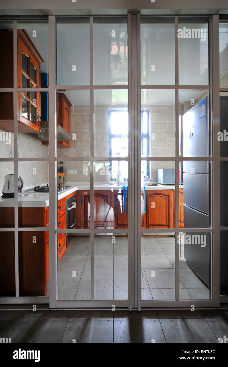 View through closed door into kitchen Stock Photo - Alamy