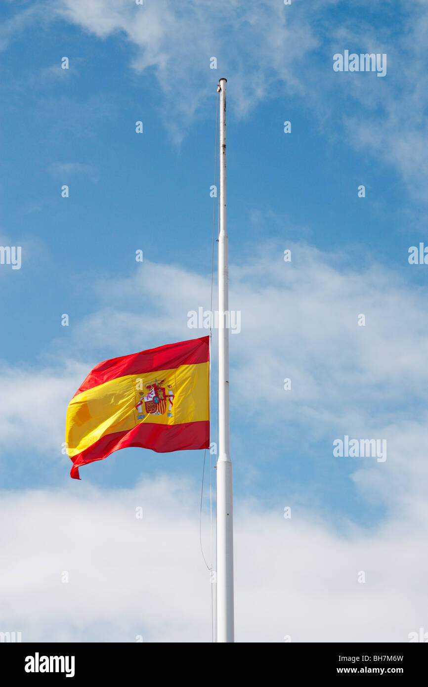 Spanish flag flying at half mast Stock Photo - Alamy