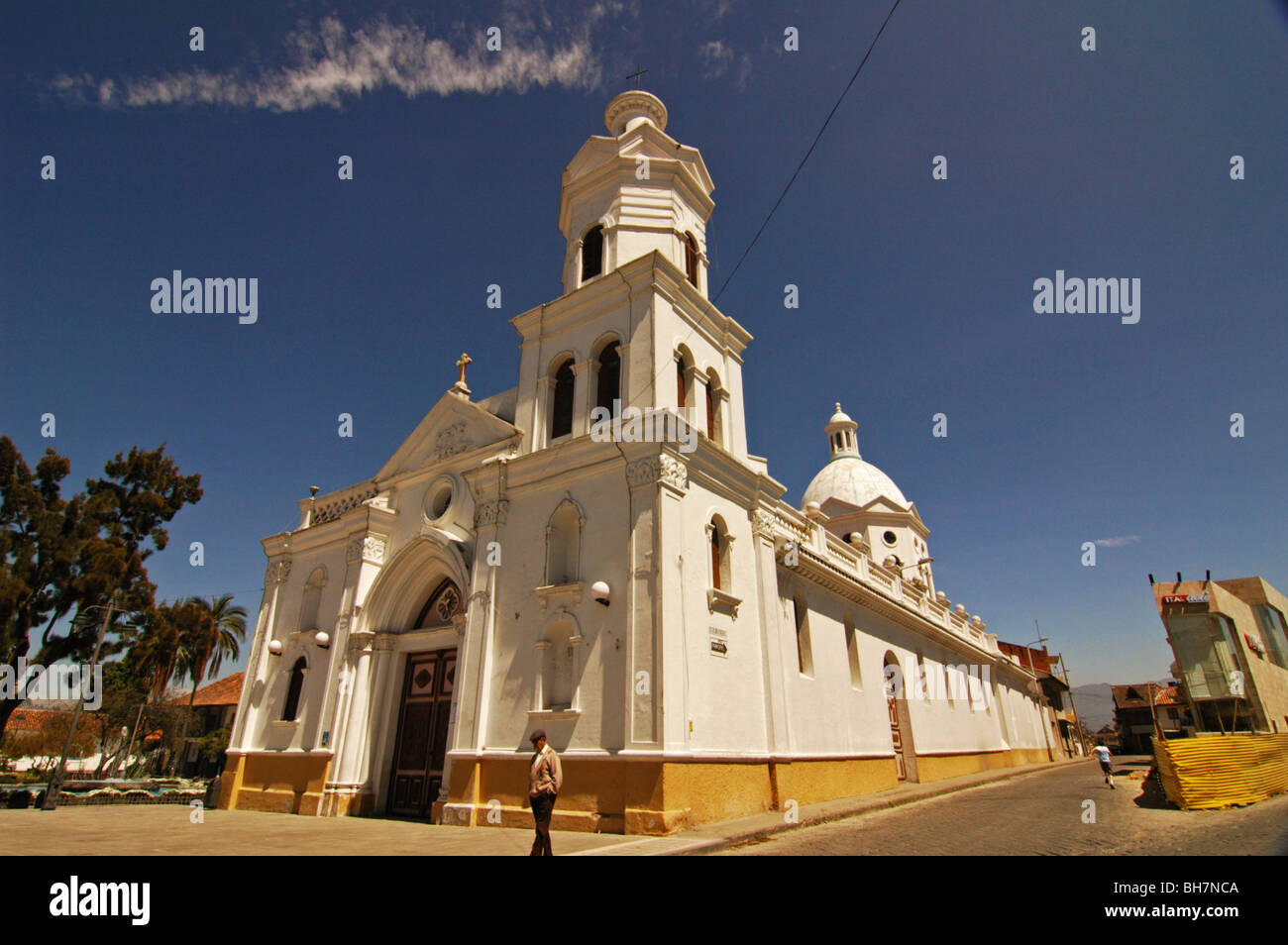 Ecuador, Cuenca, Exterior of a old church at Ecuador with man walking ...