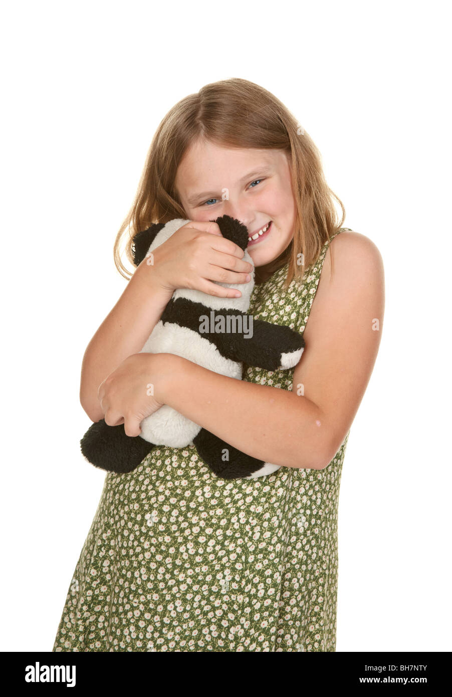 young girl gives her teddy bear a hug or cuddle Stock Photo - Alamy