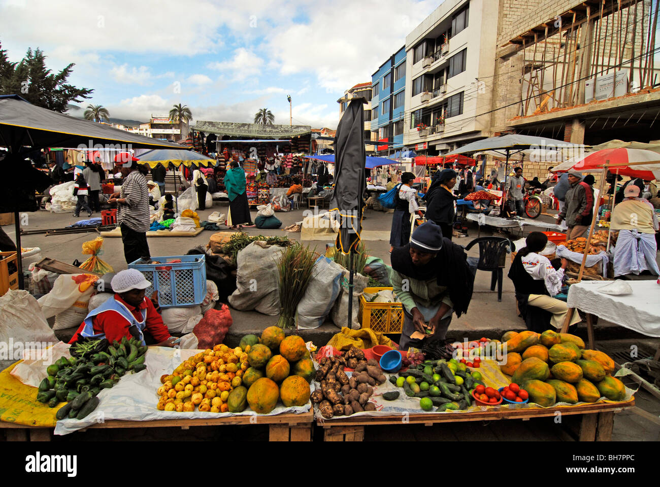 Ecuador, Otavalo, crowded market with vegetables displayed on market ...