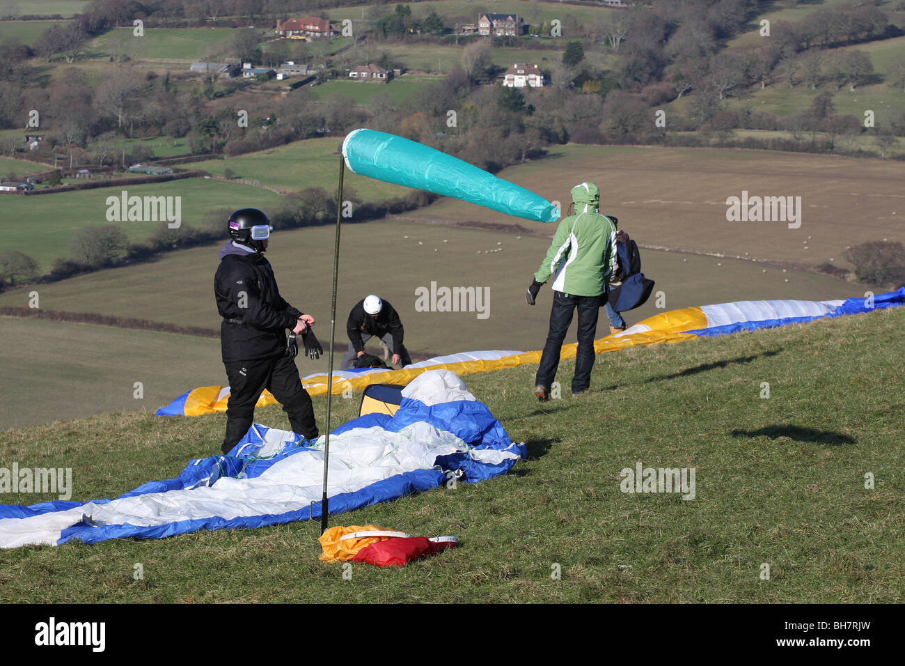 Three paragliders preparing to fly Stock Photo - Alamy