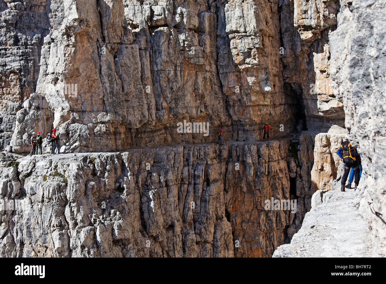 Climbers on the via ferrata Bochette Centrali in the Brenta Dolomite ...