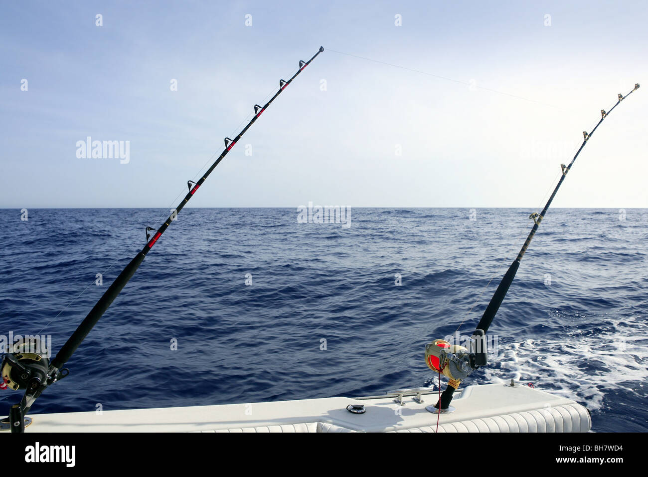 Blue Mediterranean fishing boat with rod and reels Stock Photo - Alamy
