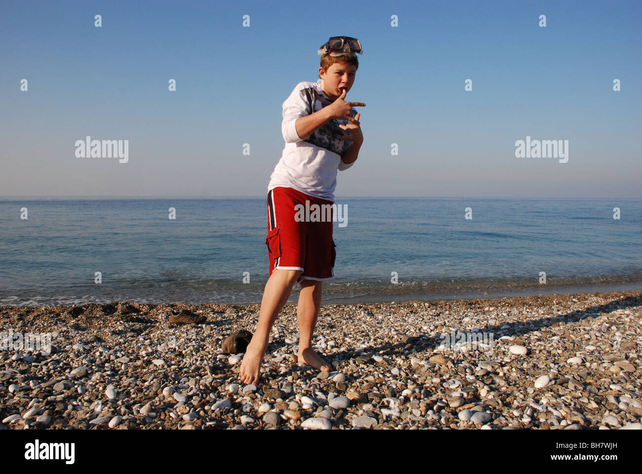 boy playing cool on the beach Stock Photo - Alamy