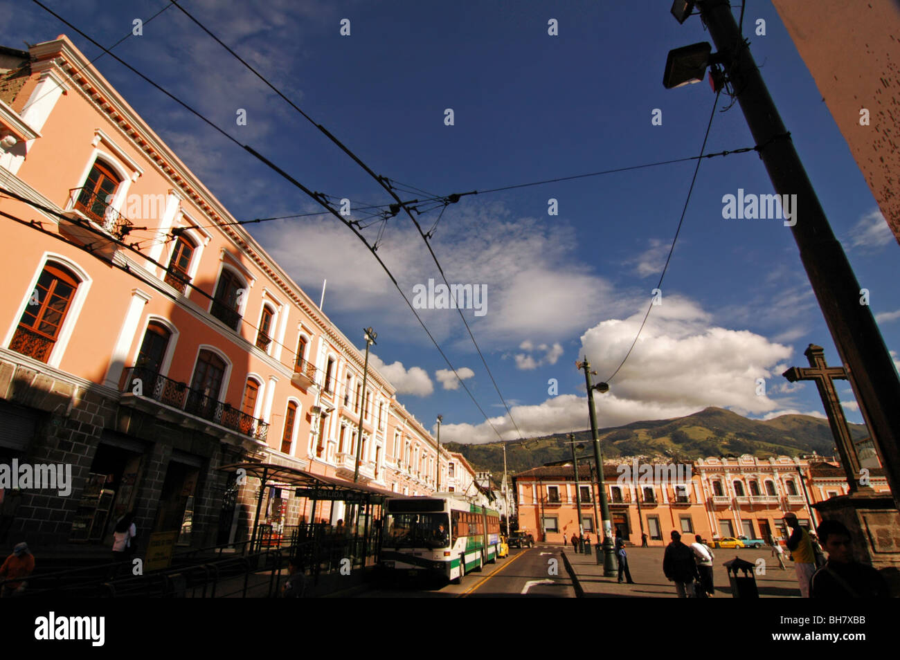 Ecuador, Quito, Ecuadorian people standing on a bus stop at Quito city ...
