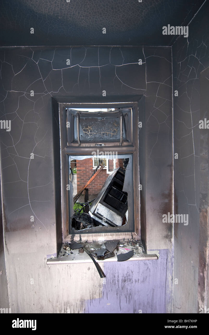 Domestic bathroom window smashed following severe fire Stock Photo - Alamy