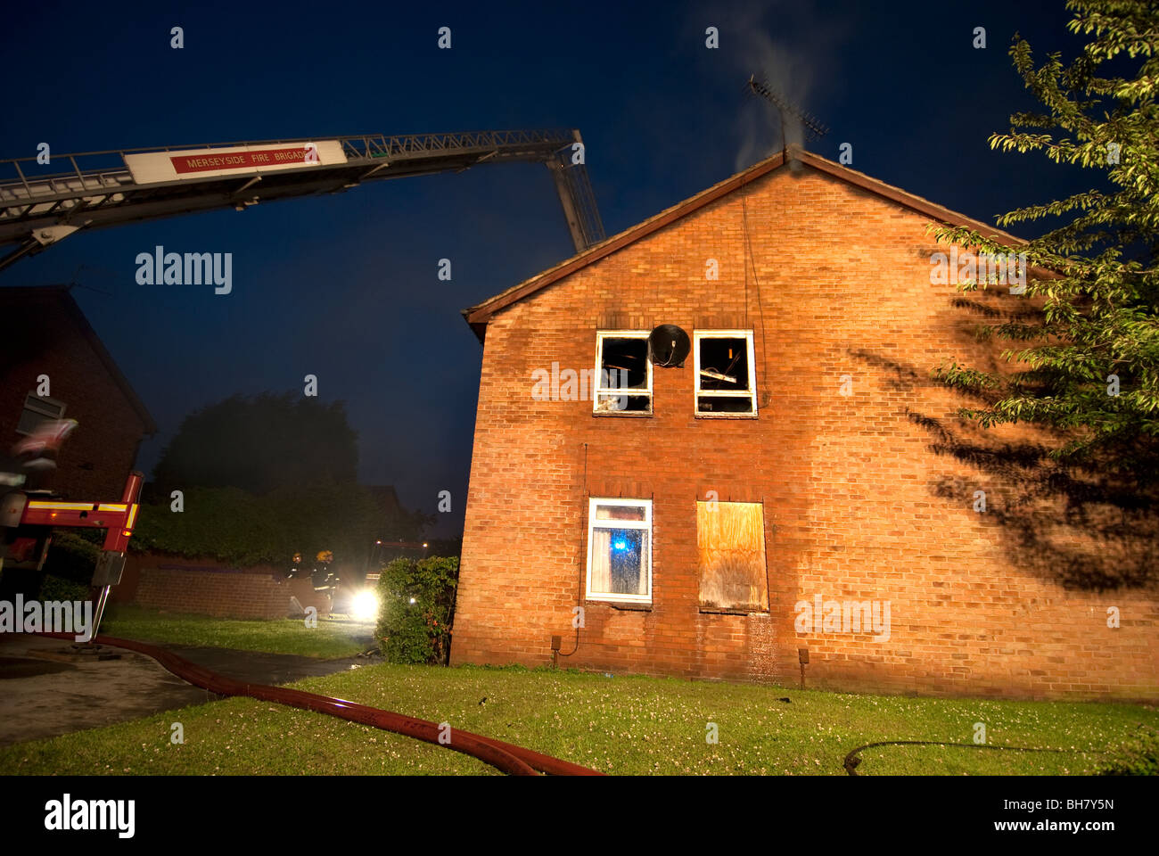 House on fire at night with Hydraulic Platform Stock Photo - Alamy