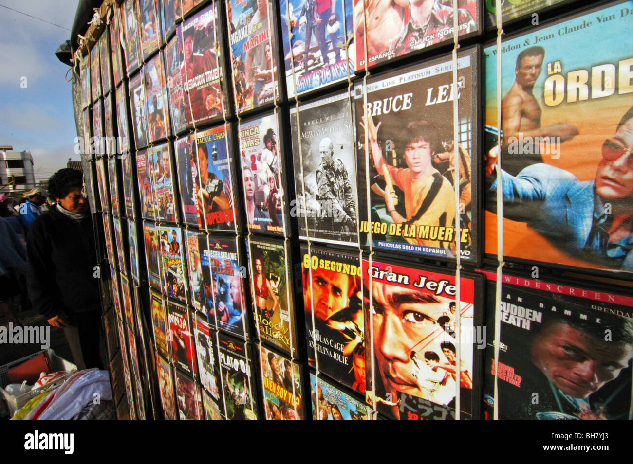 Ecuador, Saquisili, view of DVDs displayed at a market stall with ...