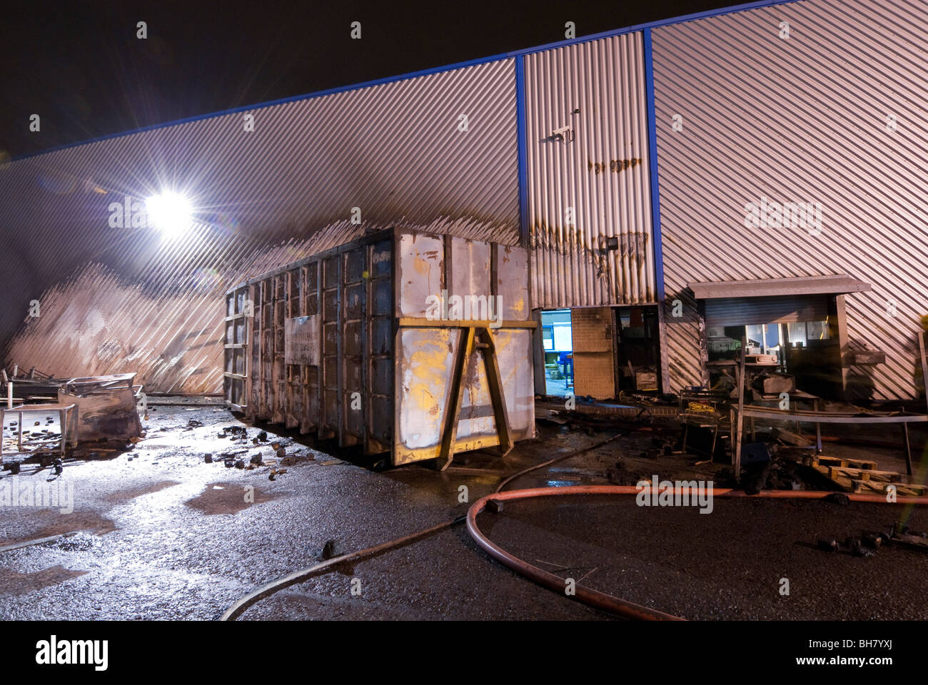 Large Skip container on fire spread to factory Stock Photo - Alamy