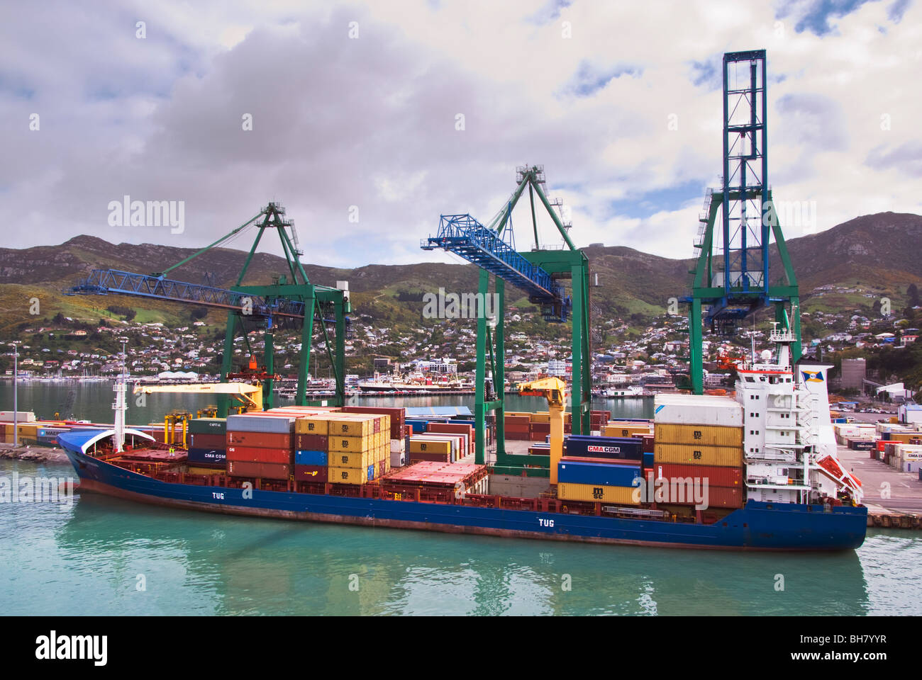 A container ship at her berth alongside the container terminal ...