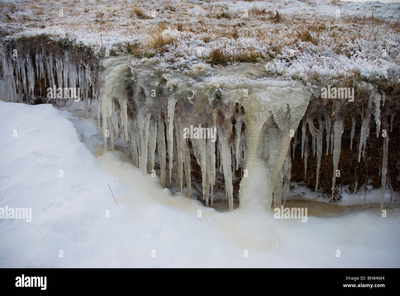 Thick icicles and snow on the Lake District fell Great Dodd Stock Photo ...