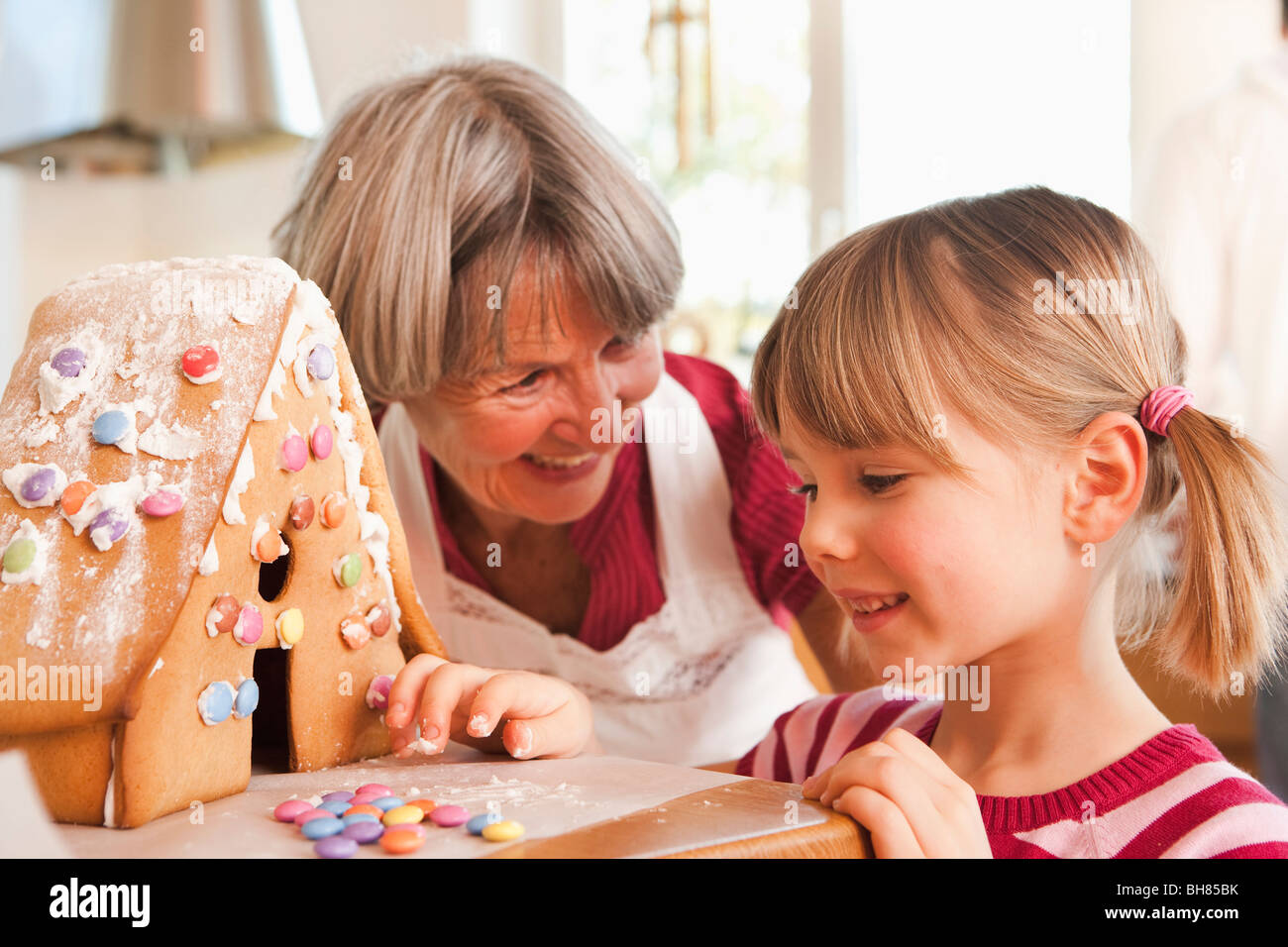 grandma and grandchild baking cake Stock Photo - Alamy
