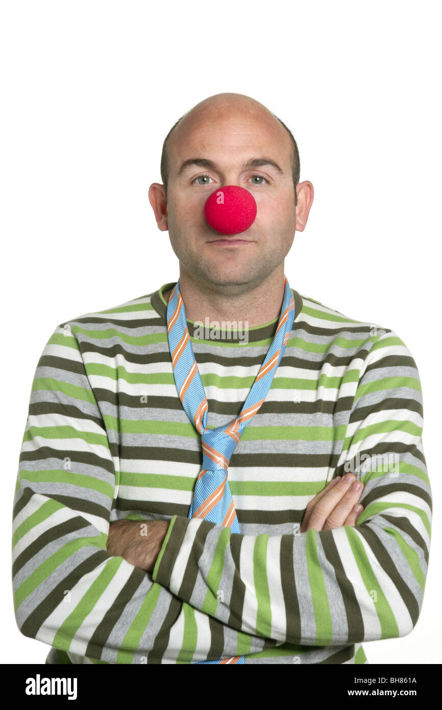 Actor clown posing crossed arms clown nose and tie Stock Photo - Alamy
