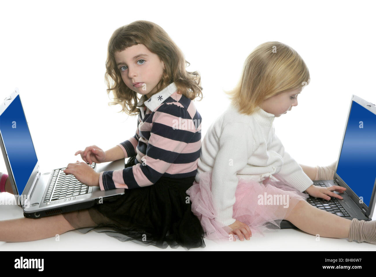two little girls sister studying computer laptops at school Stock Photo ...
