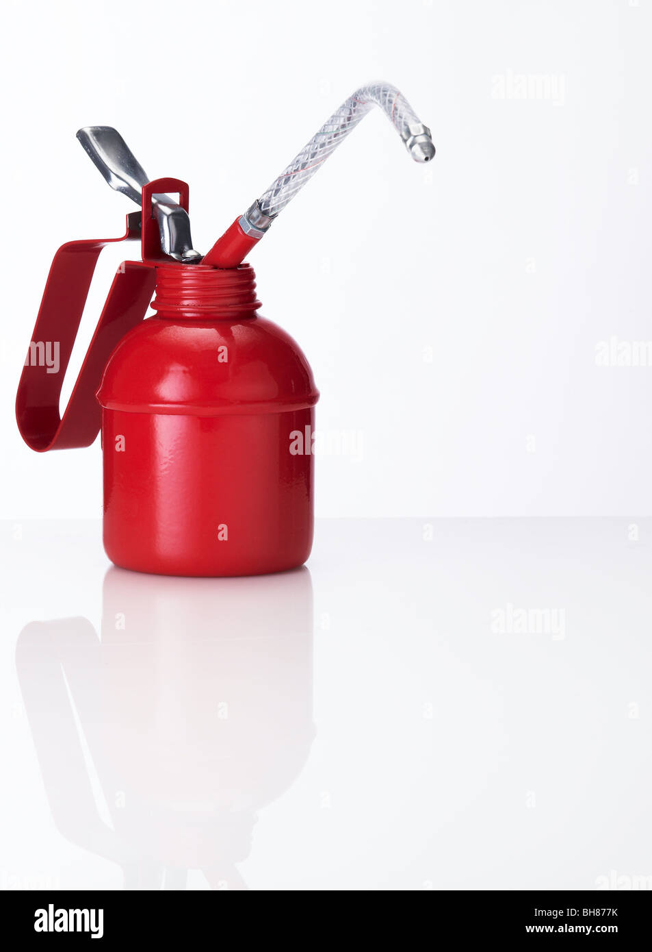 Traditional red oil can on a white background Stock Photo - Alamy